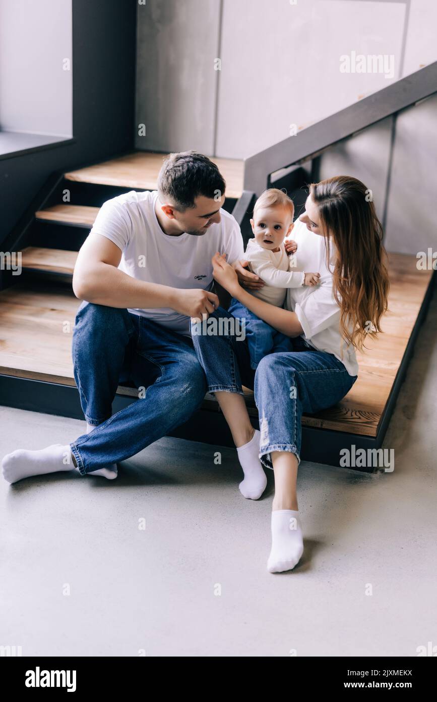 happy family with child boy play and kiss at home Stock Photo - Alamy