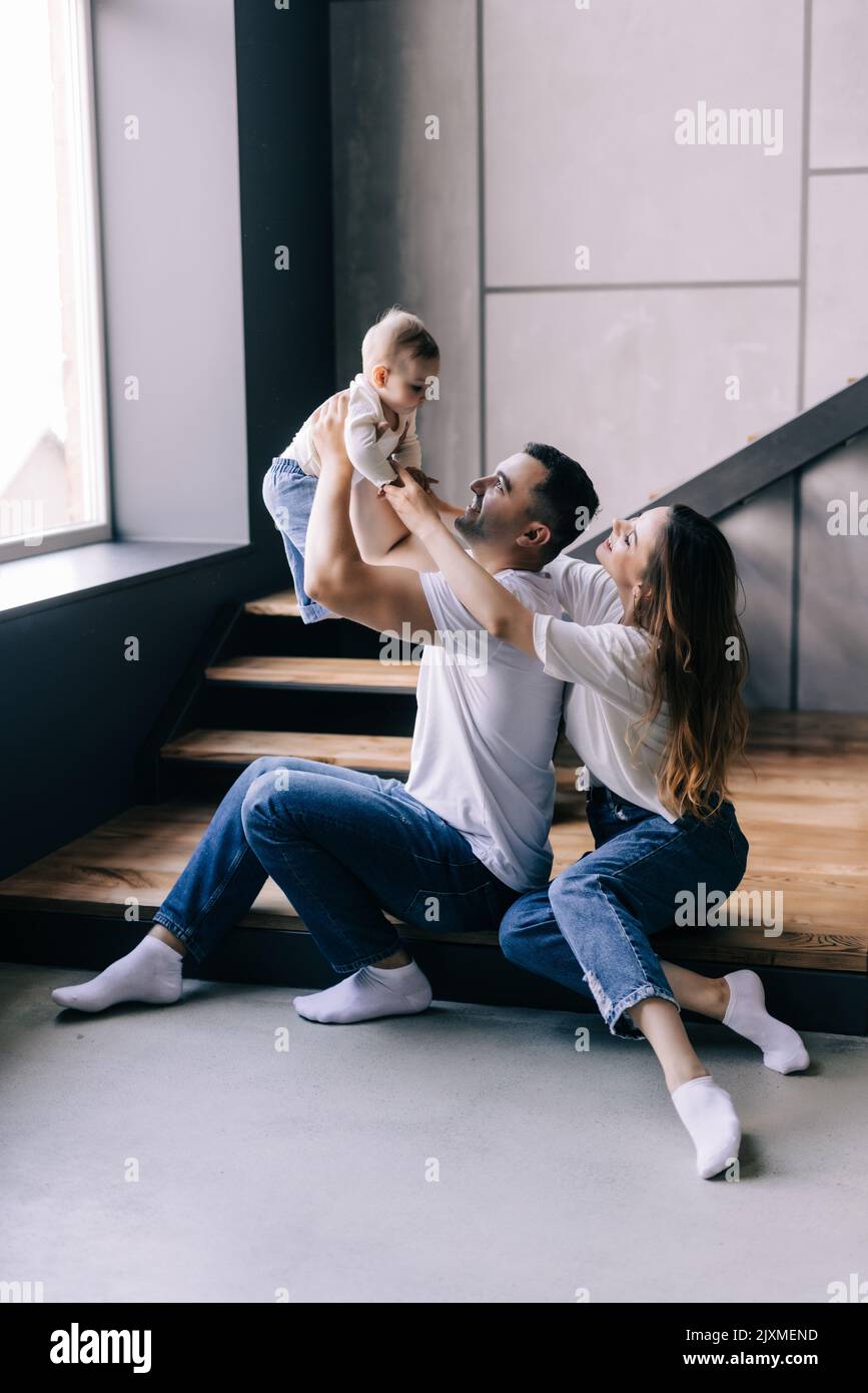 happy family with child boy play and kiss at home Stock Photo - Alamy