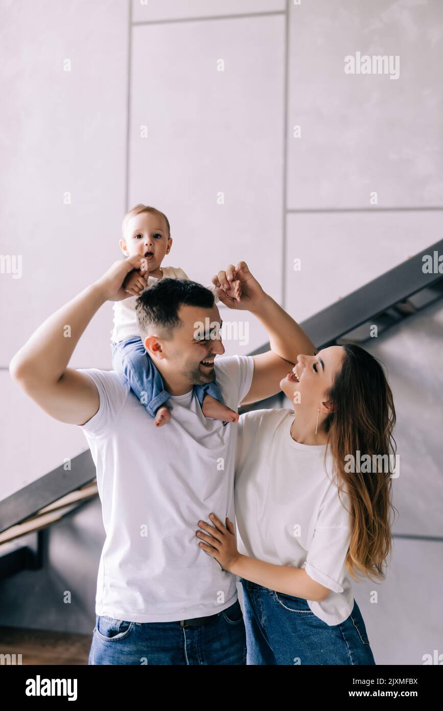 happy family with child boy play and kiss at home Stock Photo - Alamy