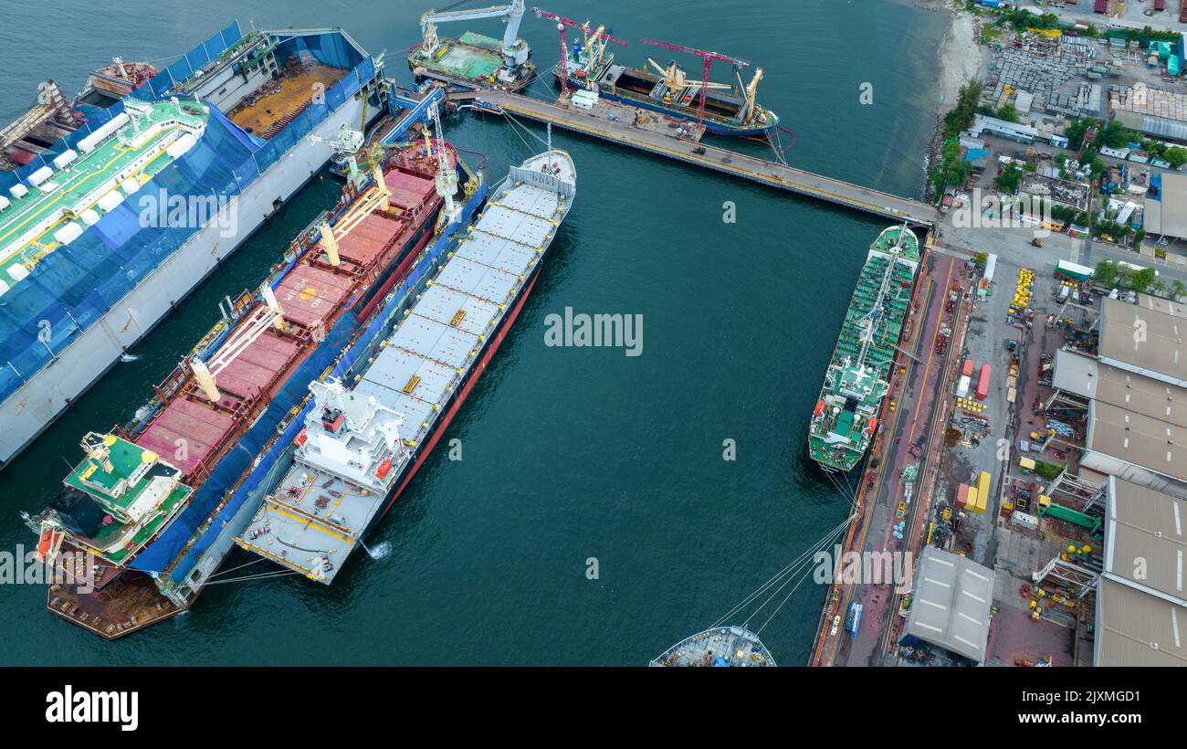 cargo container ship at dry dock concept maintenance service working in ...