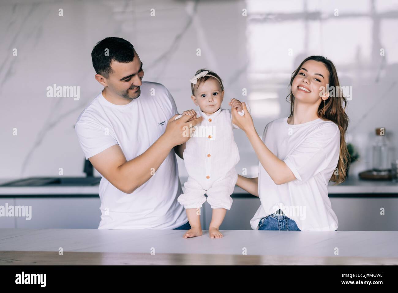 Parents hug their beloved little son. Happy time together Stock Photo ...