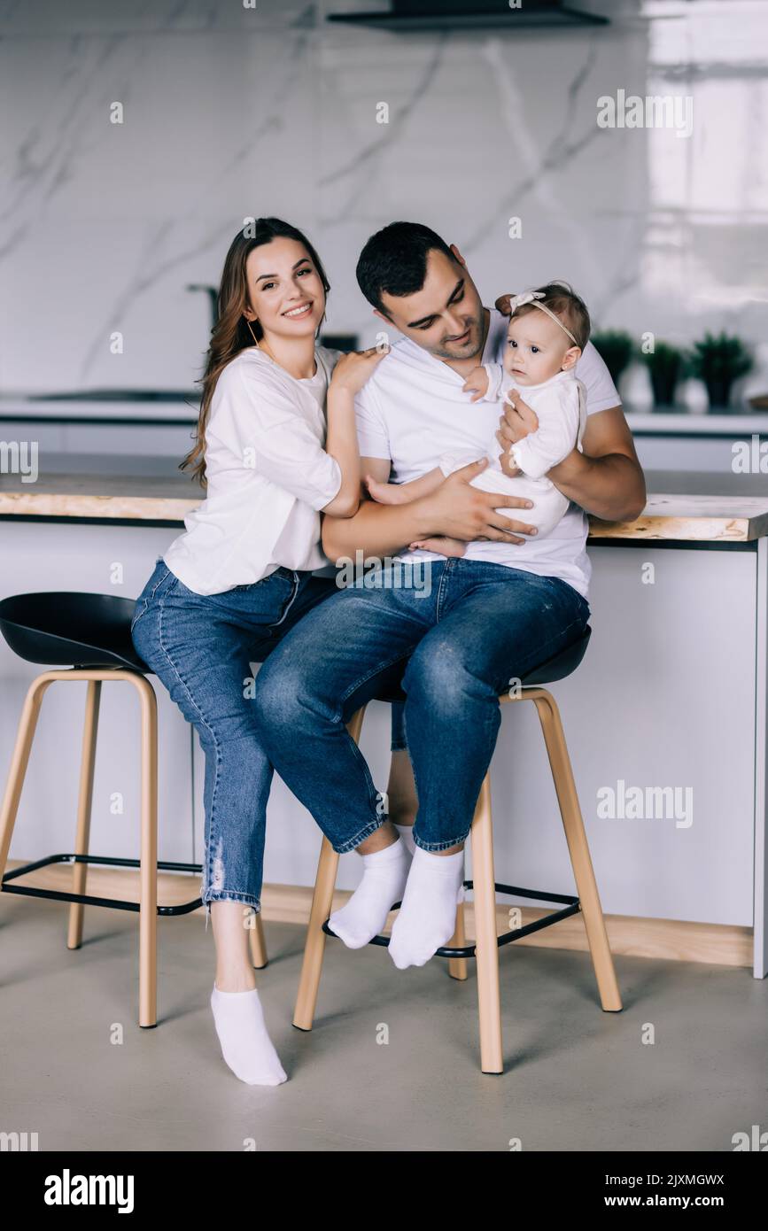 Parents hug their beloved little son. Happy time together Stock Photo ...