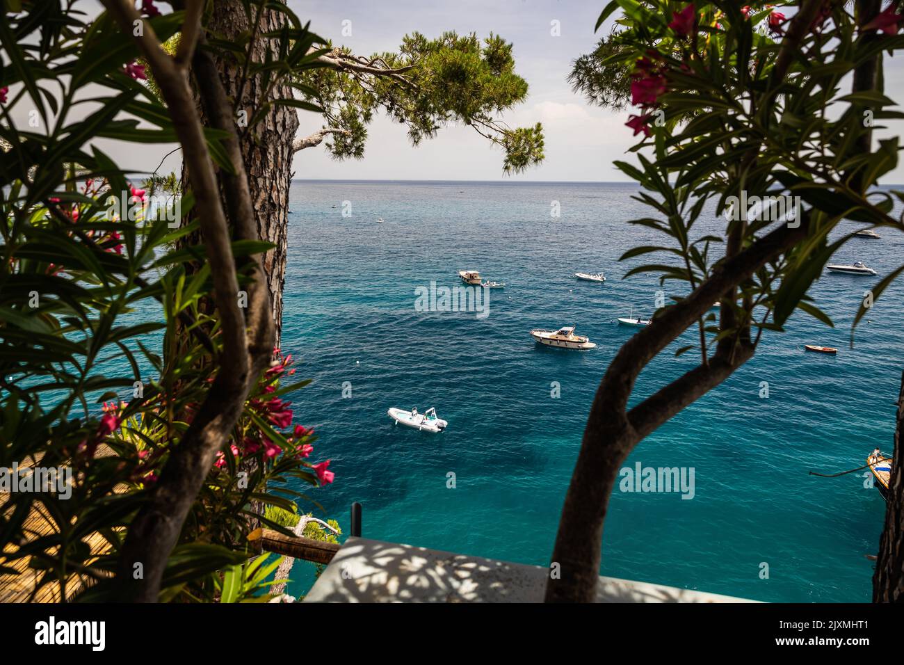 A view of boast floating on the blue water of the Mediterranean Sea ...