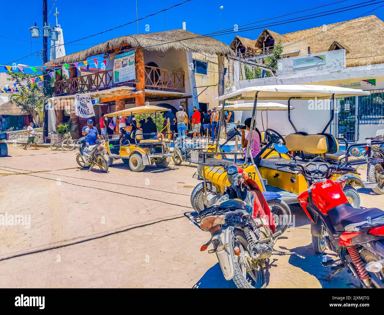 Holbox Mexico 16. May 2022 Golf cart buggy cars carts taxi on muddy ...