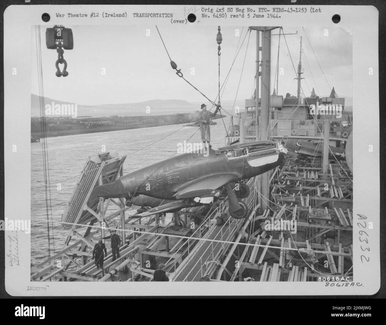 North American P-51s are transferred from the deck of an American ...