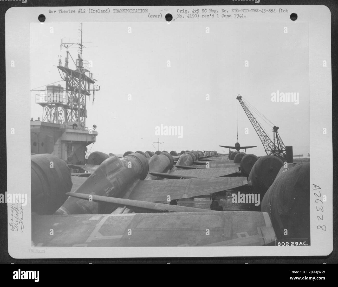 Republic P-47 "Thunderbolts" are unloaded from the flight deck of a ...