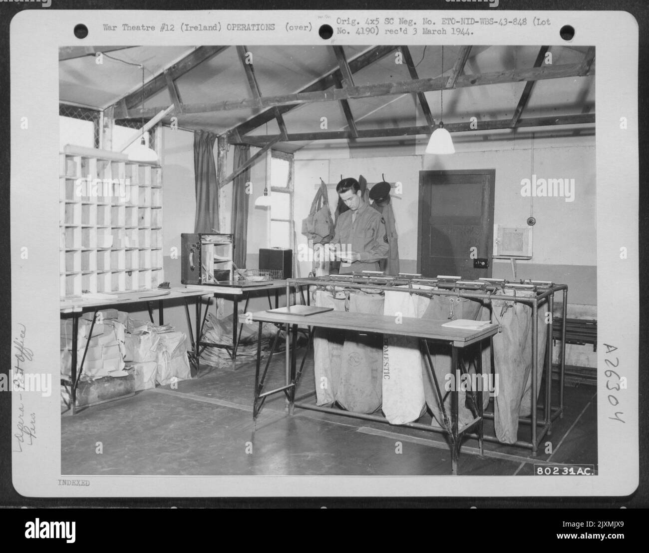 S/Sgt. William Armstrong, Cumnor, Virginia, U.S. Army mail clerk, sorts ...