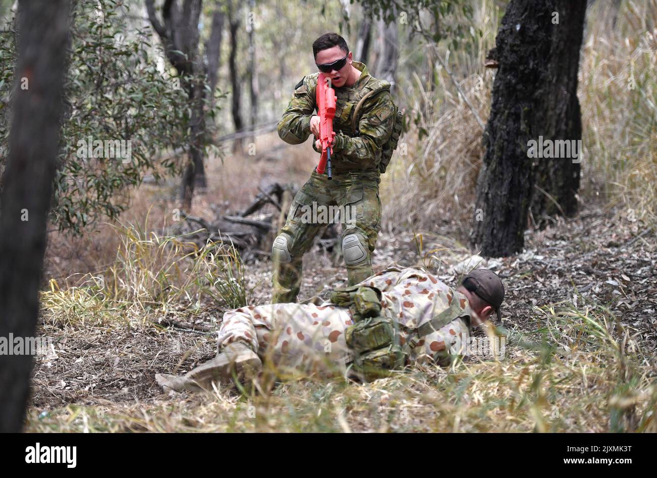 A soldier from Australia's 7th Combat Brigade (top) takes aim at a US ...