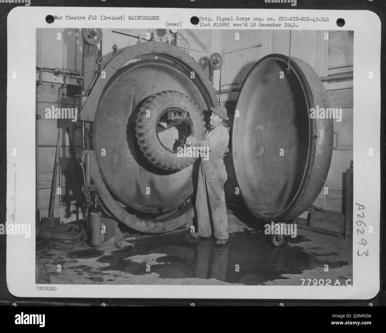 A Lockheed technician of the Lockheed Overseas Corporation prepares a ...