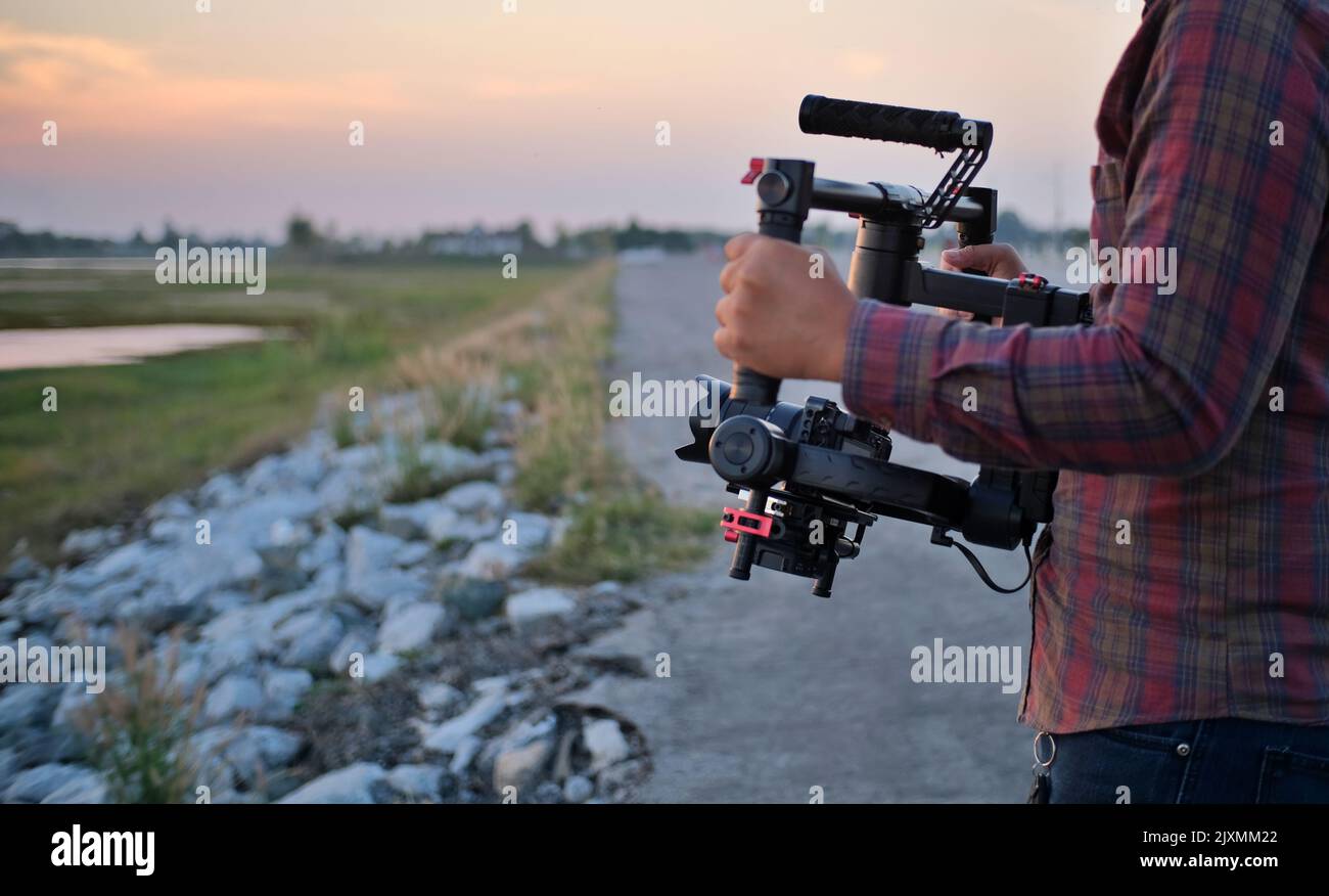 Camera technician working on a gimbal When shooting movies on a small ...