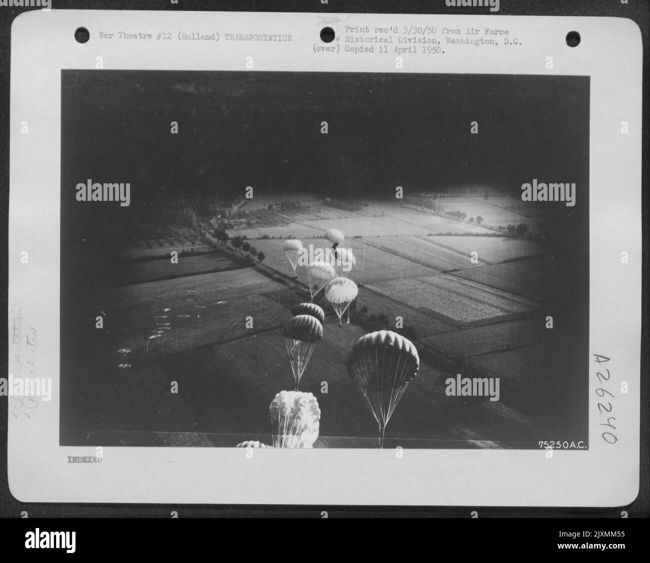 OVER THE NETHERLANDS--Supplies are dropped from the air to paratroopers ...