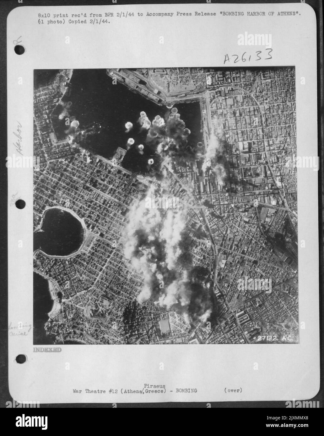 Clouds of smoke rise from the bomb-battered dock area of Athens, Greece ...