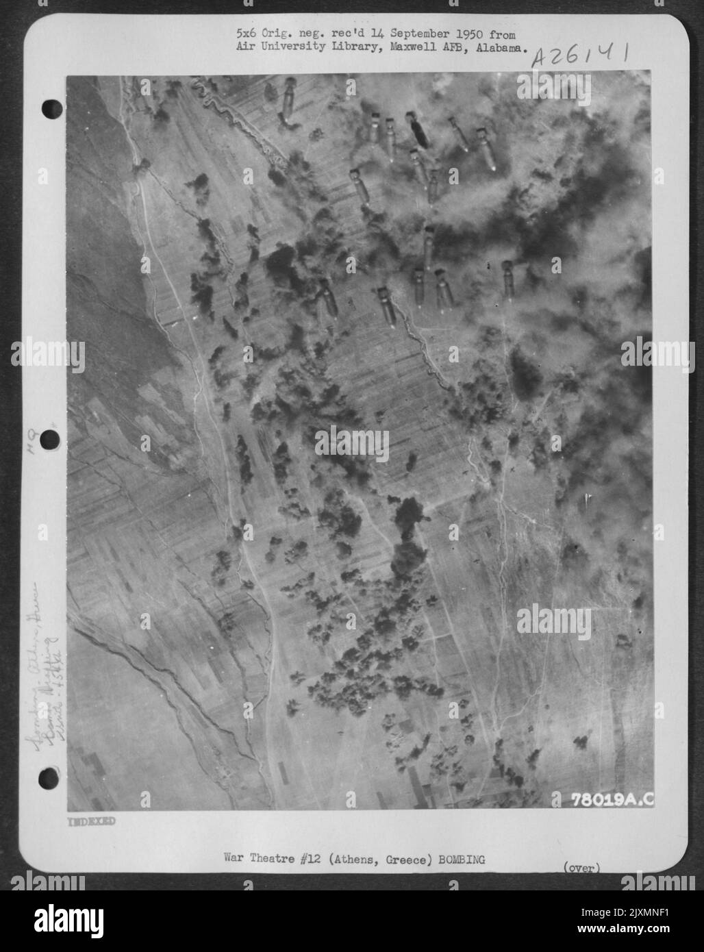 Bombs, dropped by planes of the 454th Bomb Group, descend on Tatoi ...
