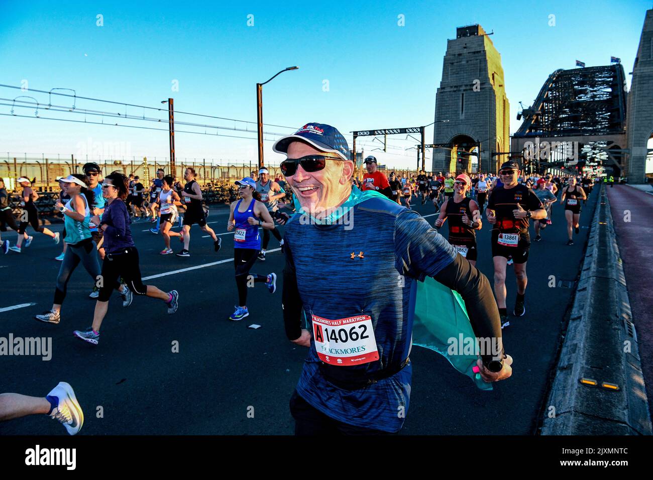 Runners are seen crossing the Sydney Harbour Bridge during the ...
