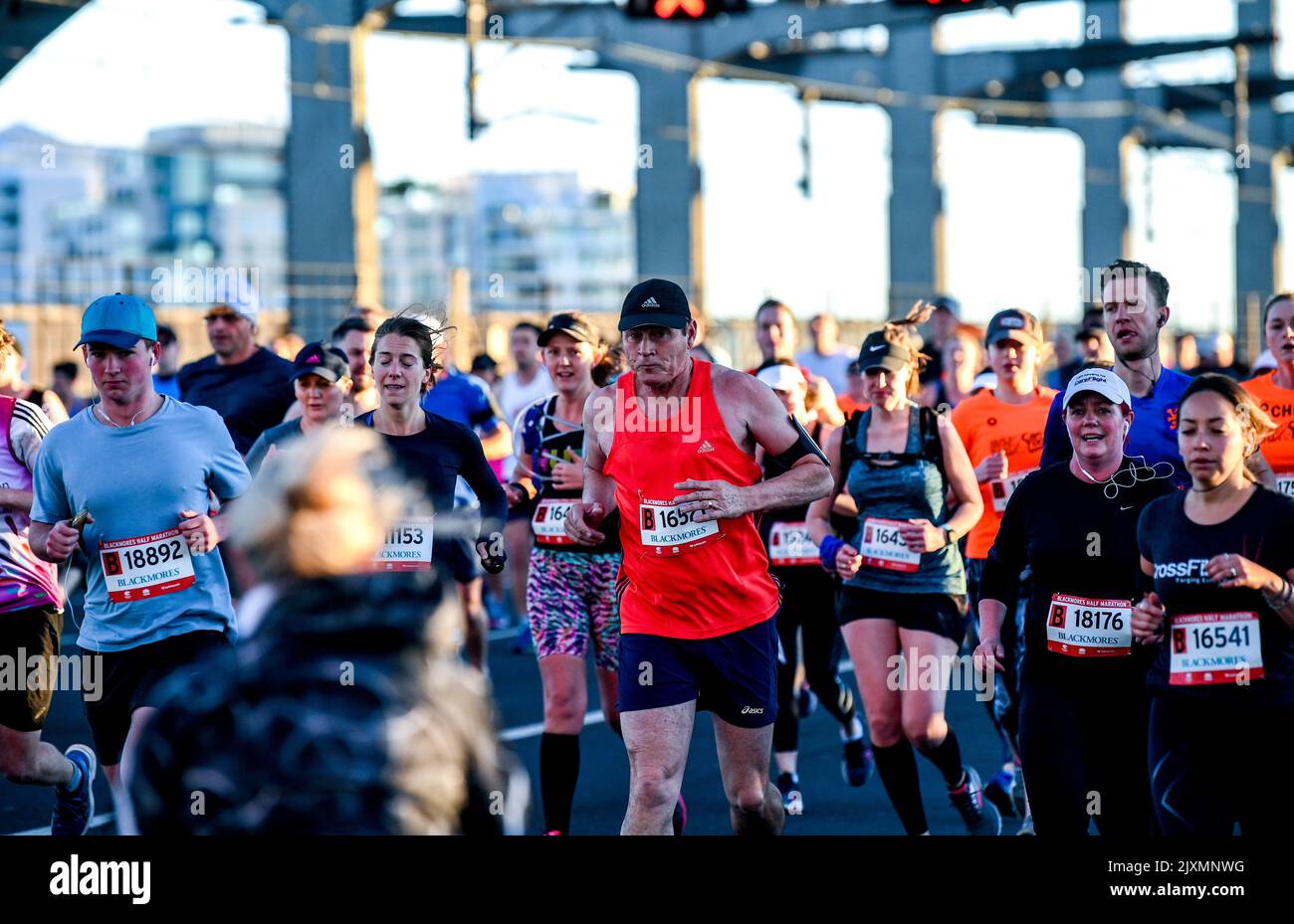 Runners are seen crossing the Sydney Harbour Bridge during the ...