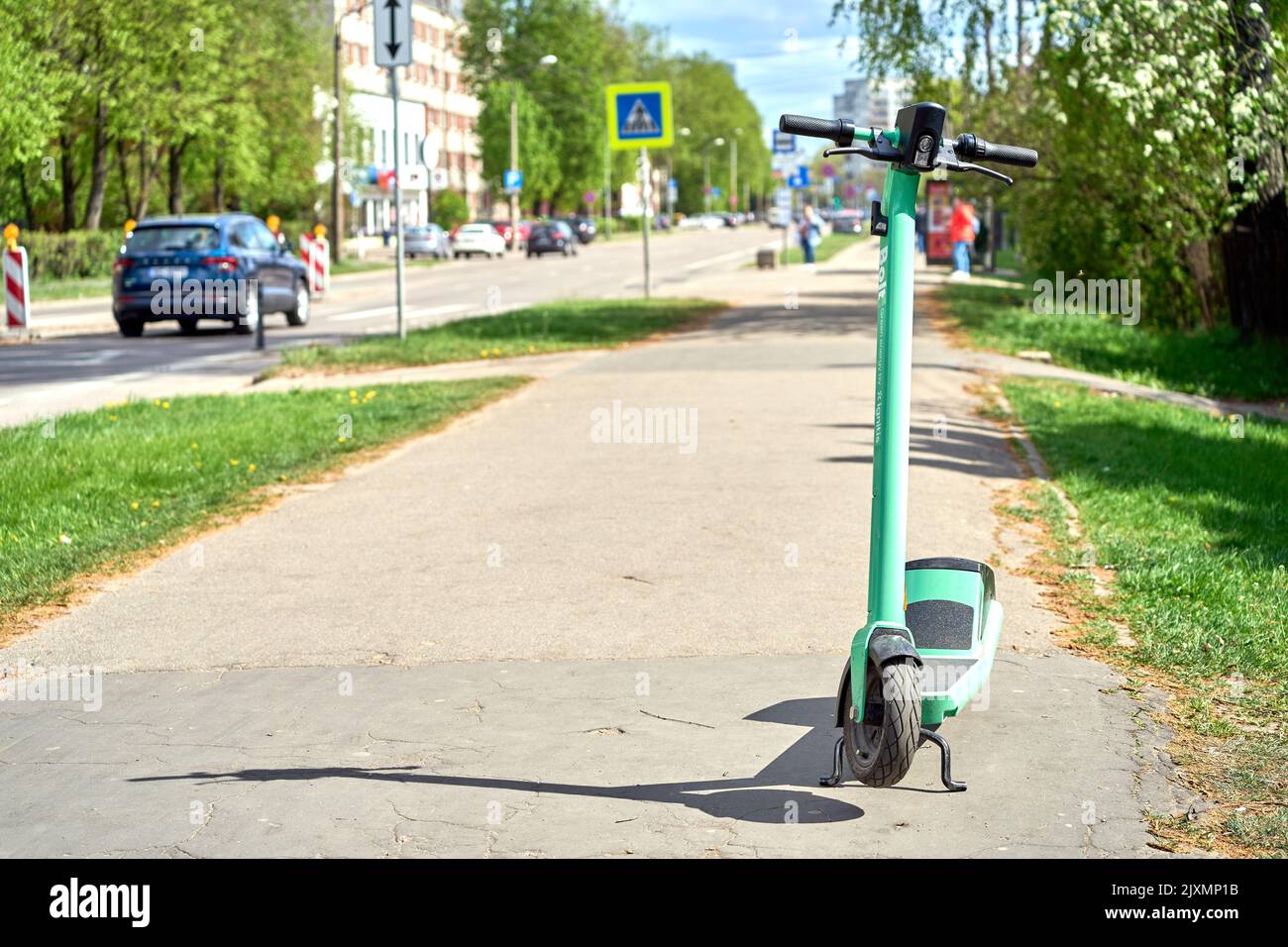 RIGA, LATVIA - MAY 13, 2022: A green electric scooter standing on the ...