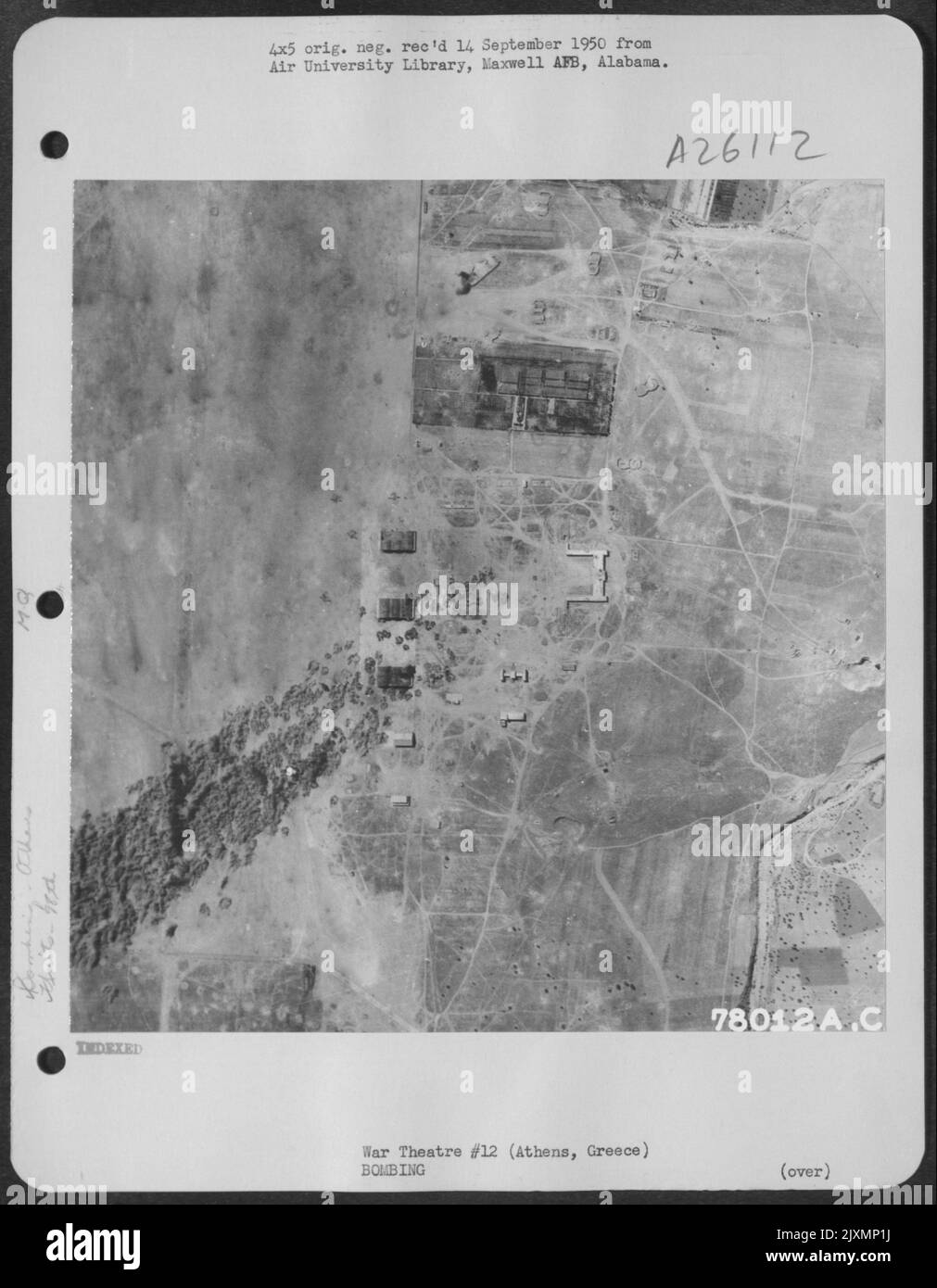 Bomb bursts on the airfield at Eleusis Airdrome, Athens, Greece, leave ...