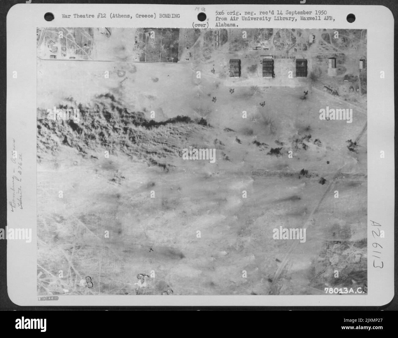 Smoke rises from Eleusis Airdrome, Athens, Greece, as bombs dropped by ...