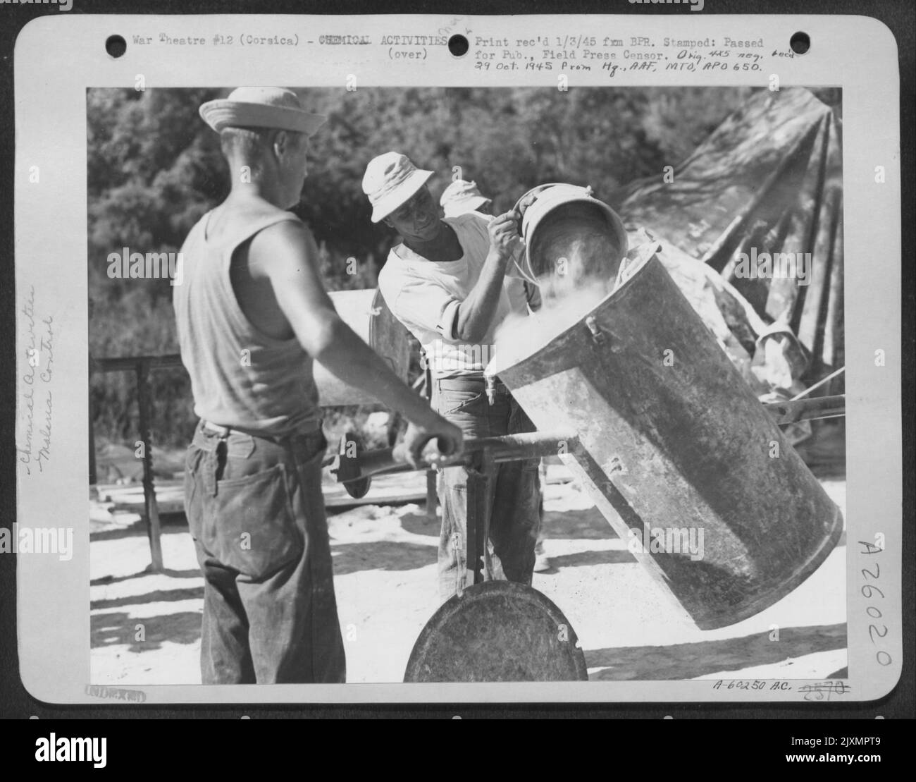 Lime and Paris Green are mixed in preparation for aerial dusting of ...