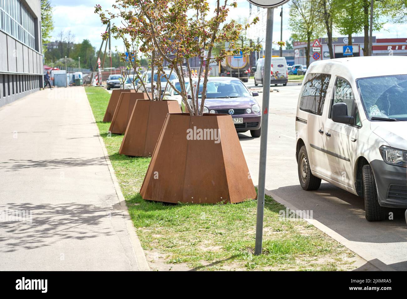 Riga, Latvia - May 13, 2022: Rusty metal covers for the young trees in ...