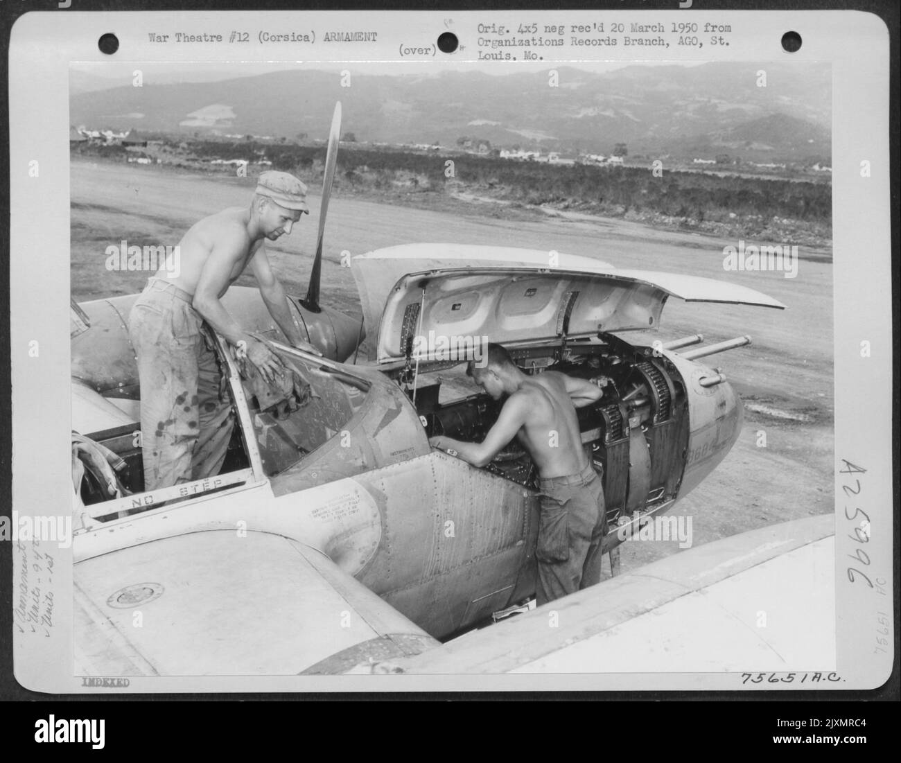 An armorer of the 94th Fighter Squadron, 1st Fighter Group checks the ...