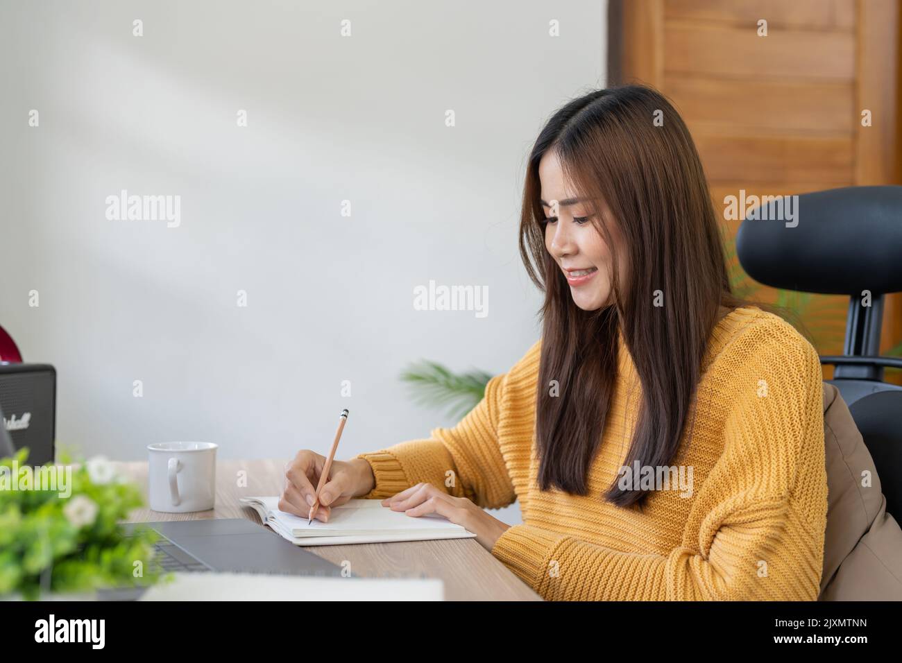 asian female student watching lesson online and studying distantly ...