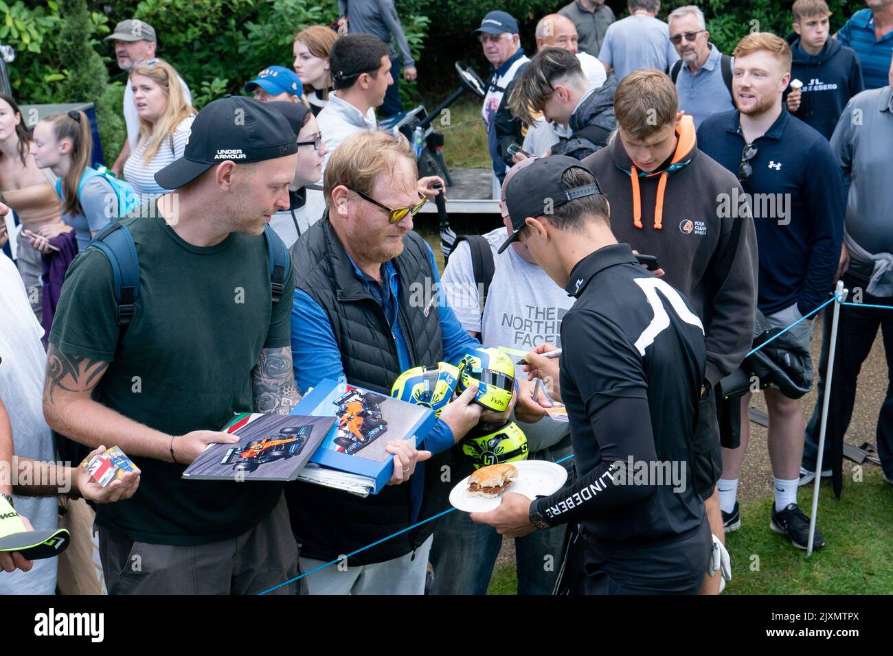 Lando Norris signs autographs during the BMW PGA Championship 2022 ...