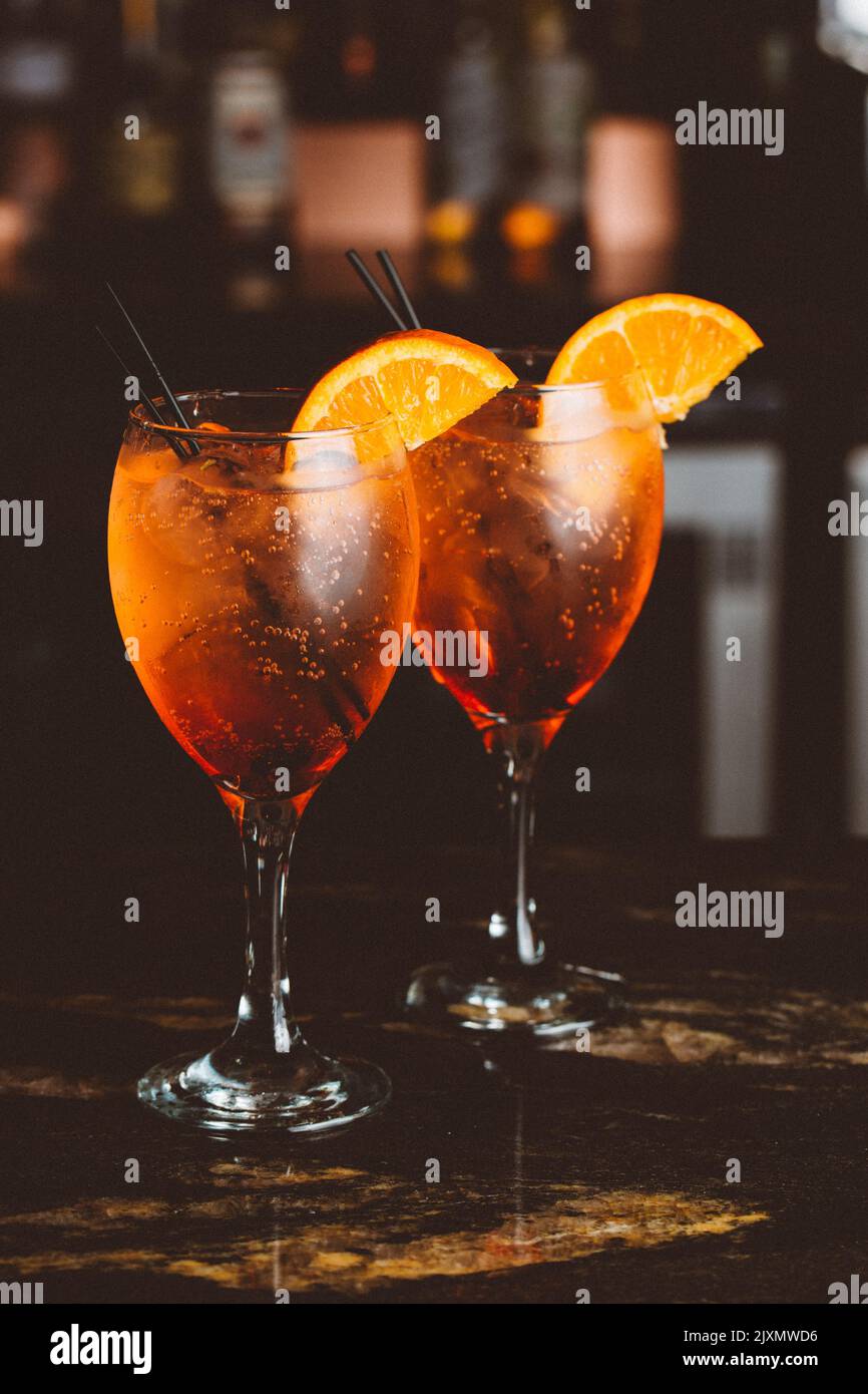 Two glasses of tasty Aperol orange juice cocktail at the bar Stock ...