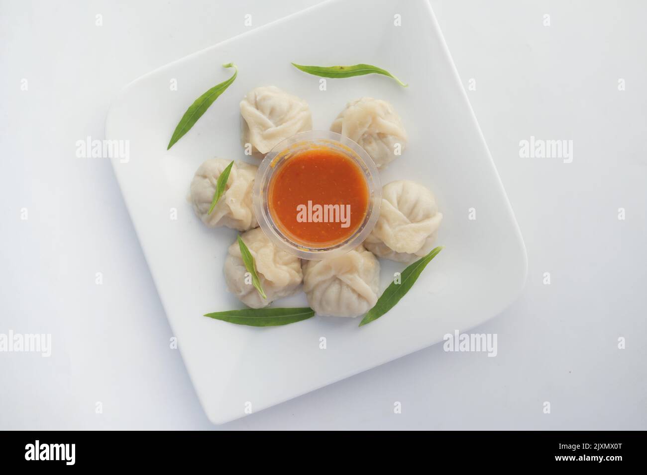 top view of chicken momo dumpling on a plate Stock Photo - Alamy