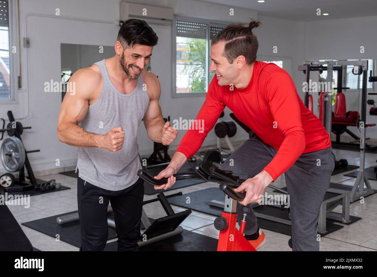 Two Hispanic guys from Argentina working out in gym Stock Photo - Alamy