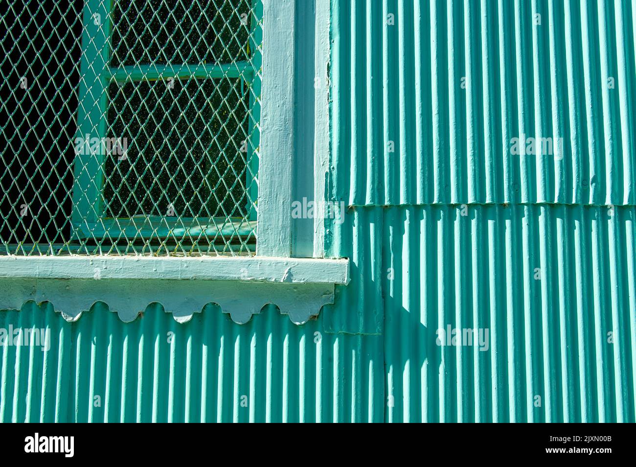Rustic background of a house with a net covering the window Stock Photo ...
