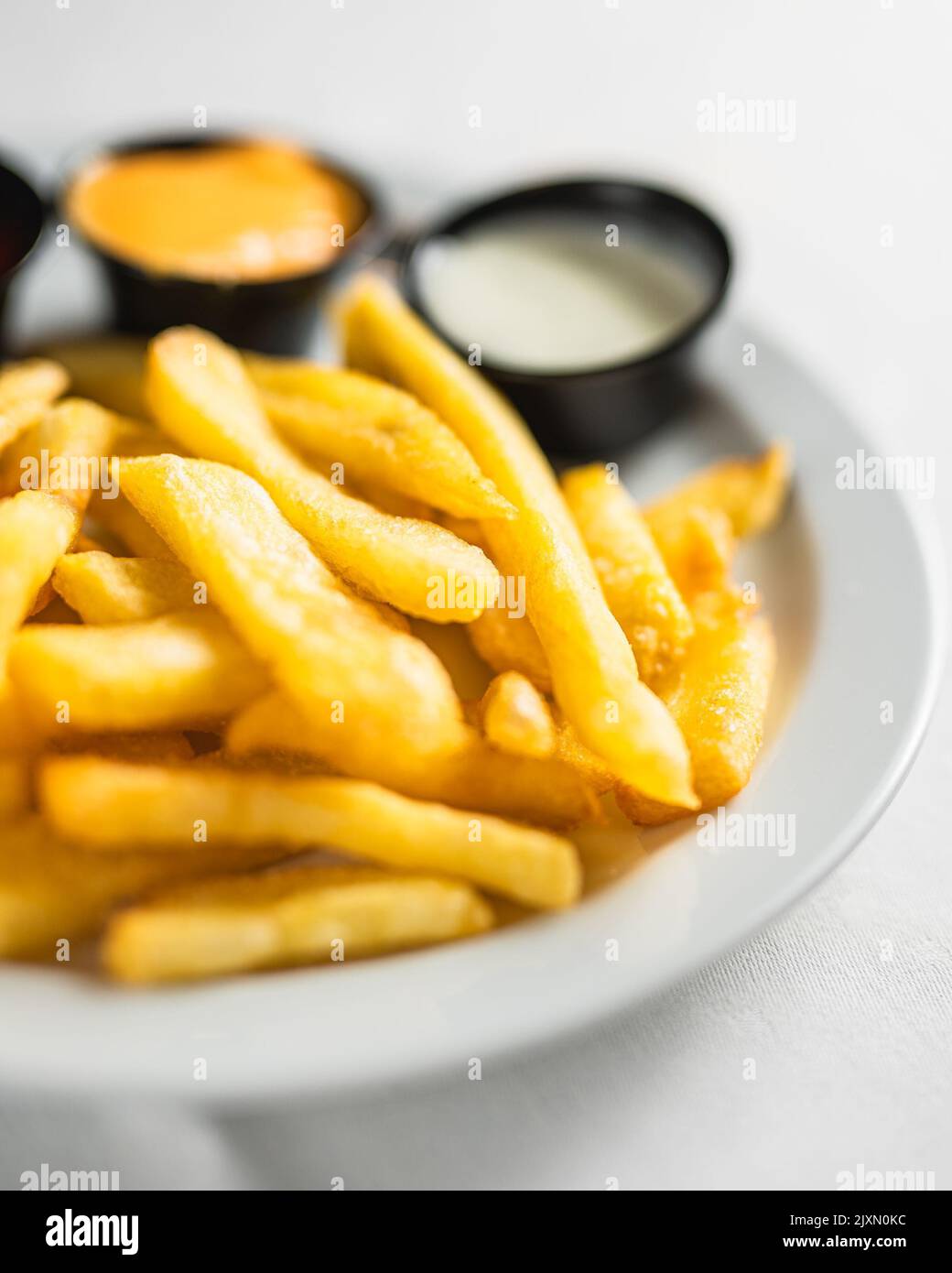 French fries with various sauces, ali oli, mustard Stock Photo - Alamy