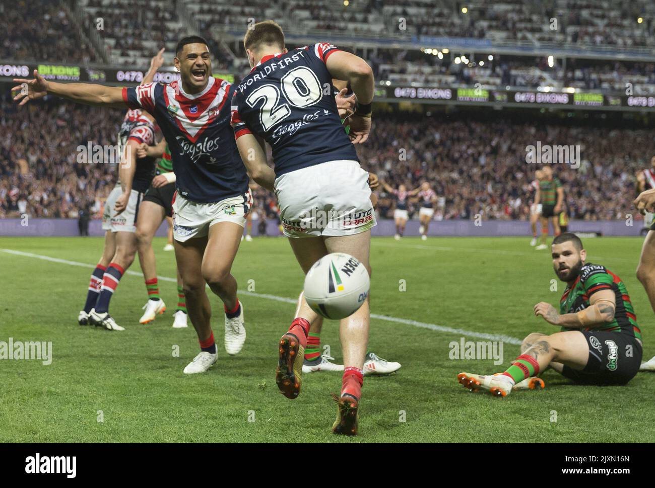 Paul Momirovski of the Roosters gets the ball after a bomb and scores ...