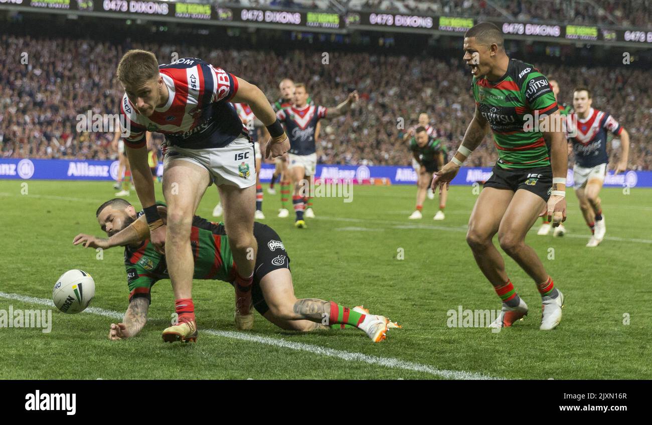 Paul Momirovski of the Roosters gets the ball after a bomb and scores ...