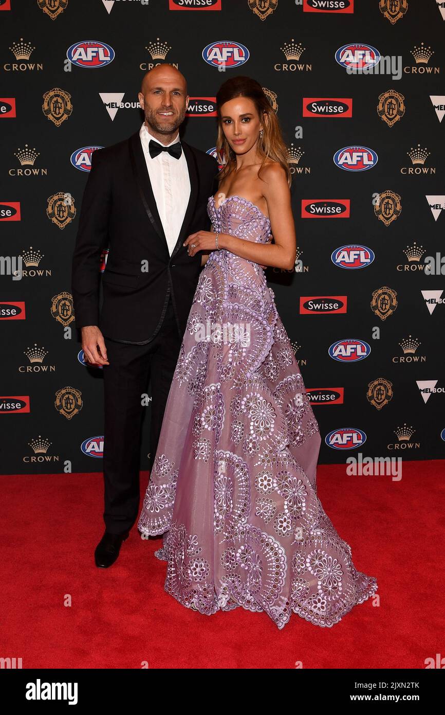 2004 and 2010 Brownlow Medalist Chris Judd and wife Rebecca Judd pose ...