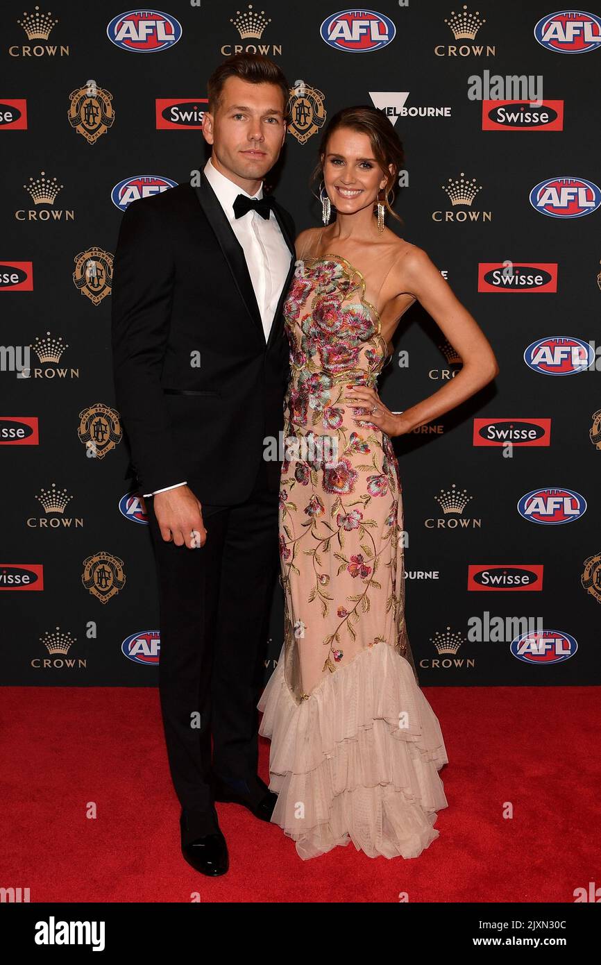 Shaun Higgins of North Melbourne and wife Heidi Higgins pose for a ...