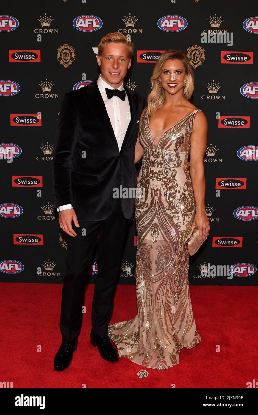 Isaac Heeney of Sydney and partner Laura Houghton pose for a photograph ...
