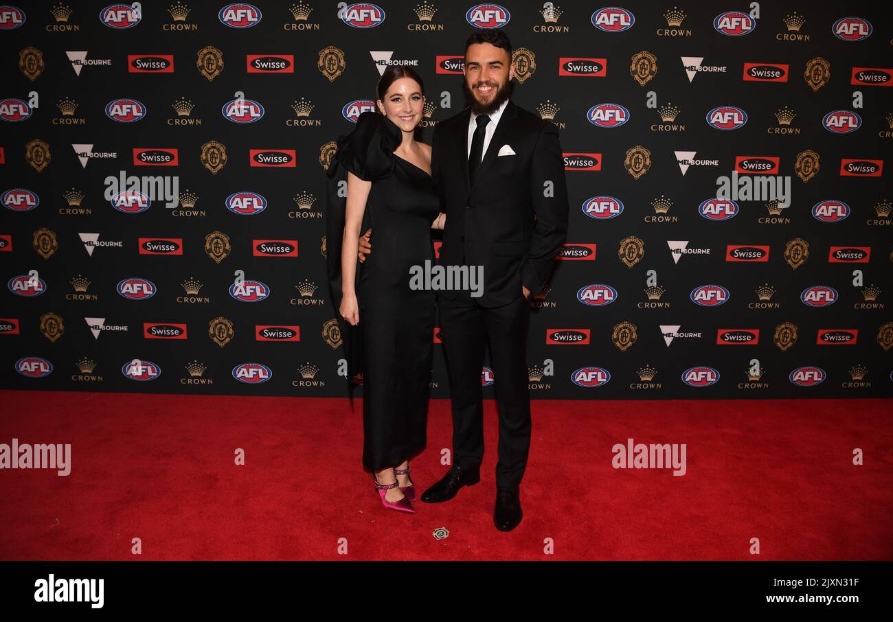 Shane Edwards (right) and his partner poss for a photograph on the red ...