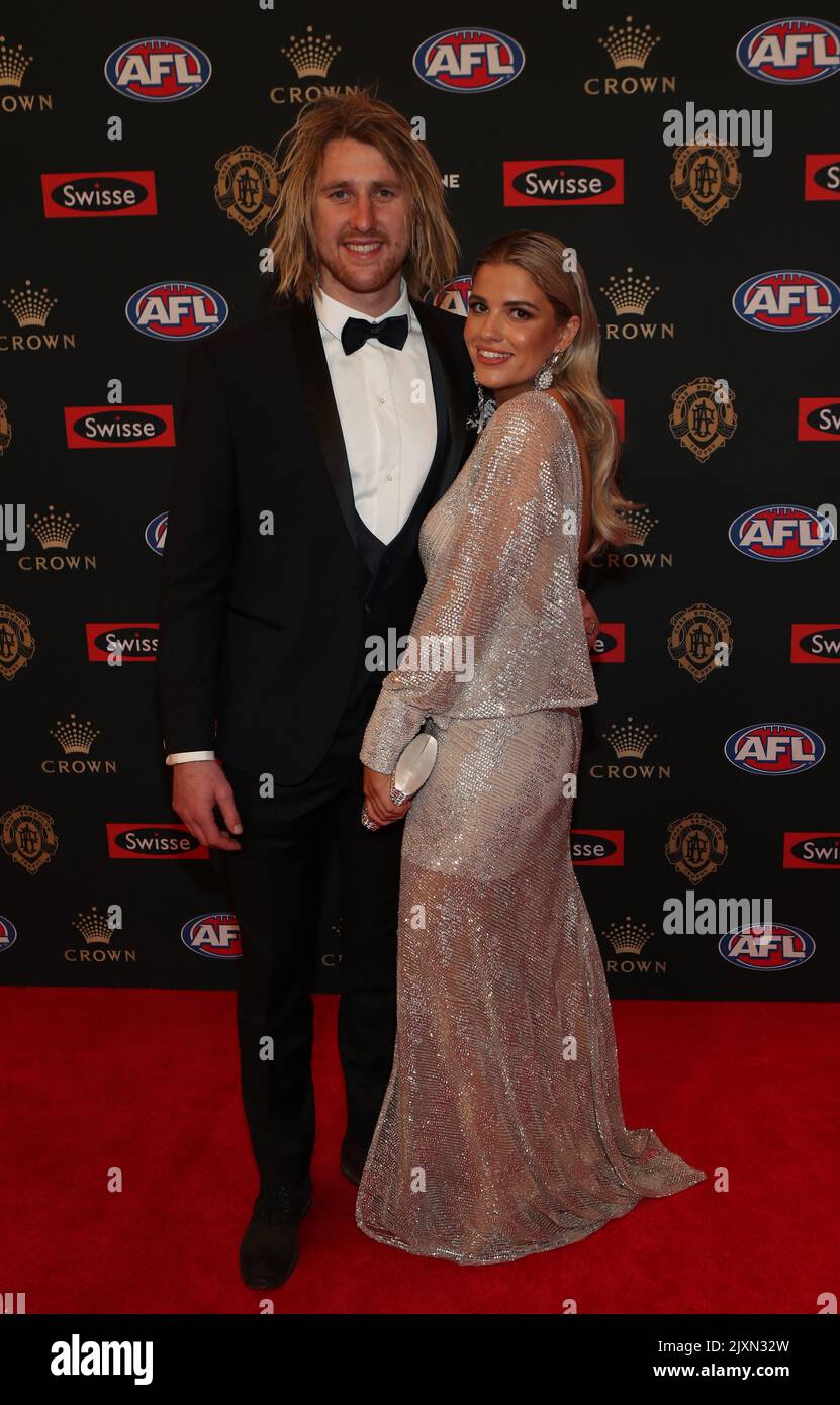 Dyson Heppell of Essendon and his partner Kate Turner, pose for a ...