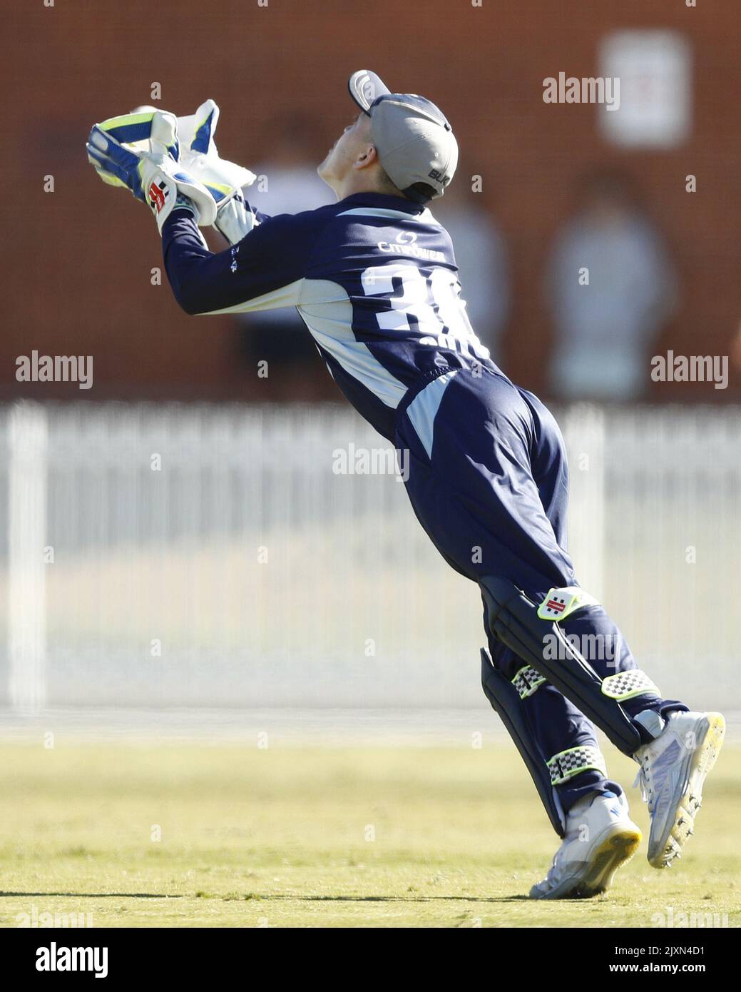Sebastian Gotch of Victoria catches D'Arcy Short of Western Australia ...