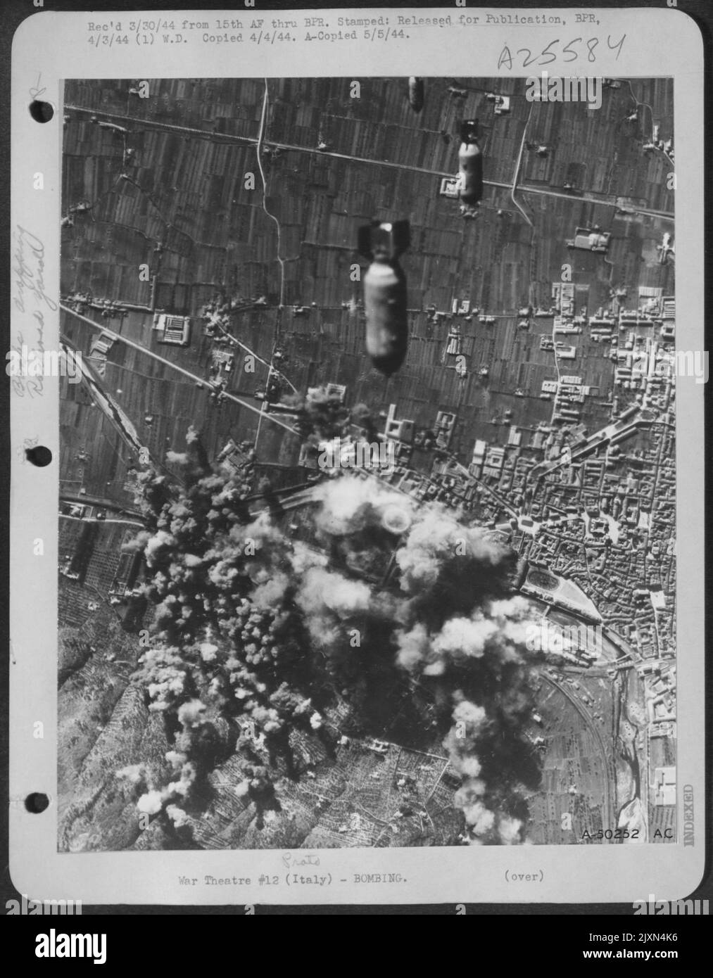 Bombs from Flying Fortresses of the 15th AAF fall on the marshalling ...