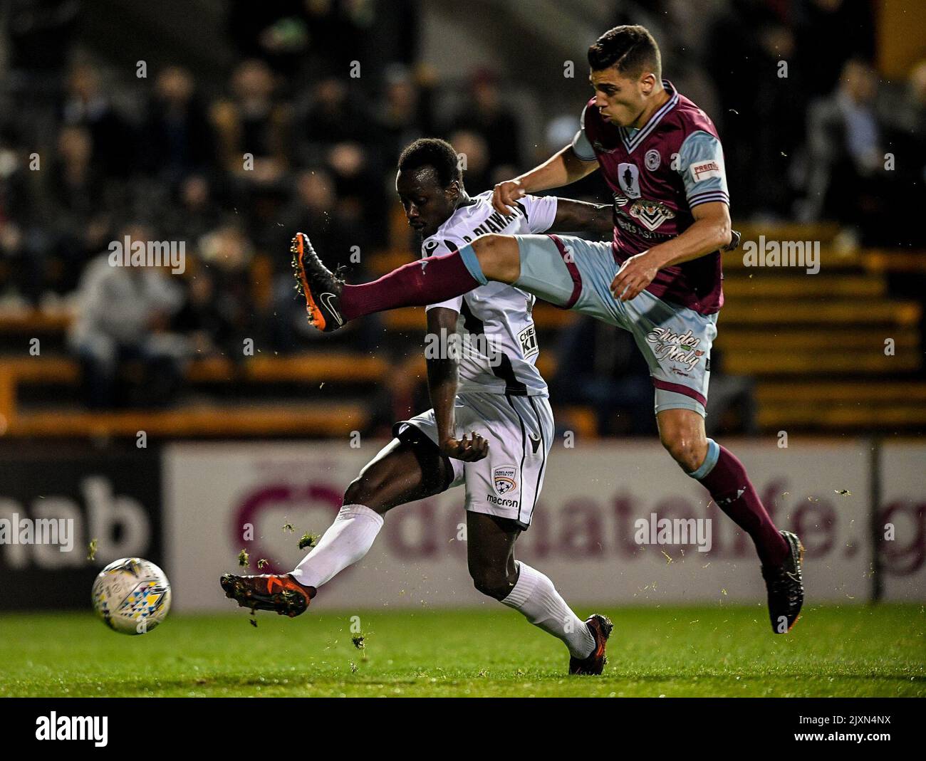 Paul Galimi (right) of Apia Competes for possession against Papa ...