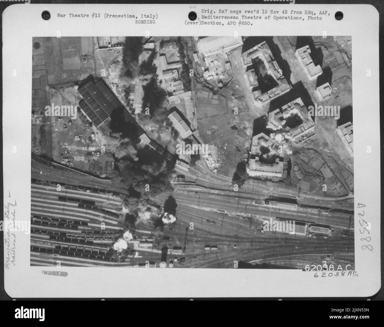 Heavy black clouds of smoke roll upward from bomb strikes on ...