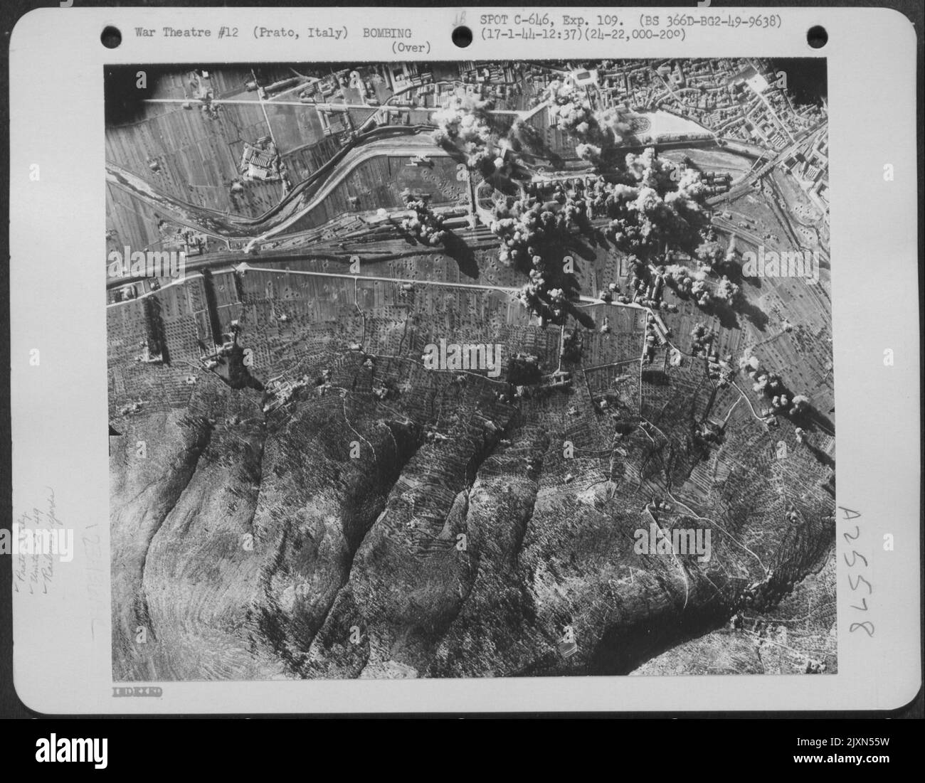 Smoke rises from numerous bomb strikes on the marshalling yards at ...