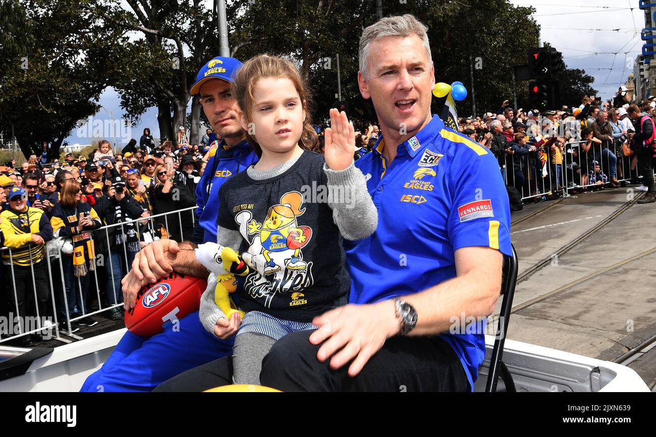 Eagles captain Shannon Hurn (left), coach Adam Simpson and his daughter ...