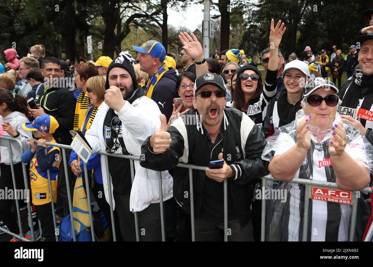 Fans line the streets during the AFL Grand Final Parade in Melbourne ...