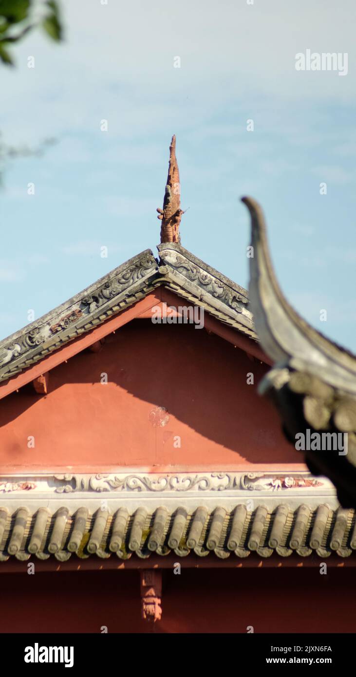A vertical shot of a traditional Chinese house roof in Huanglongxi ...