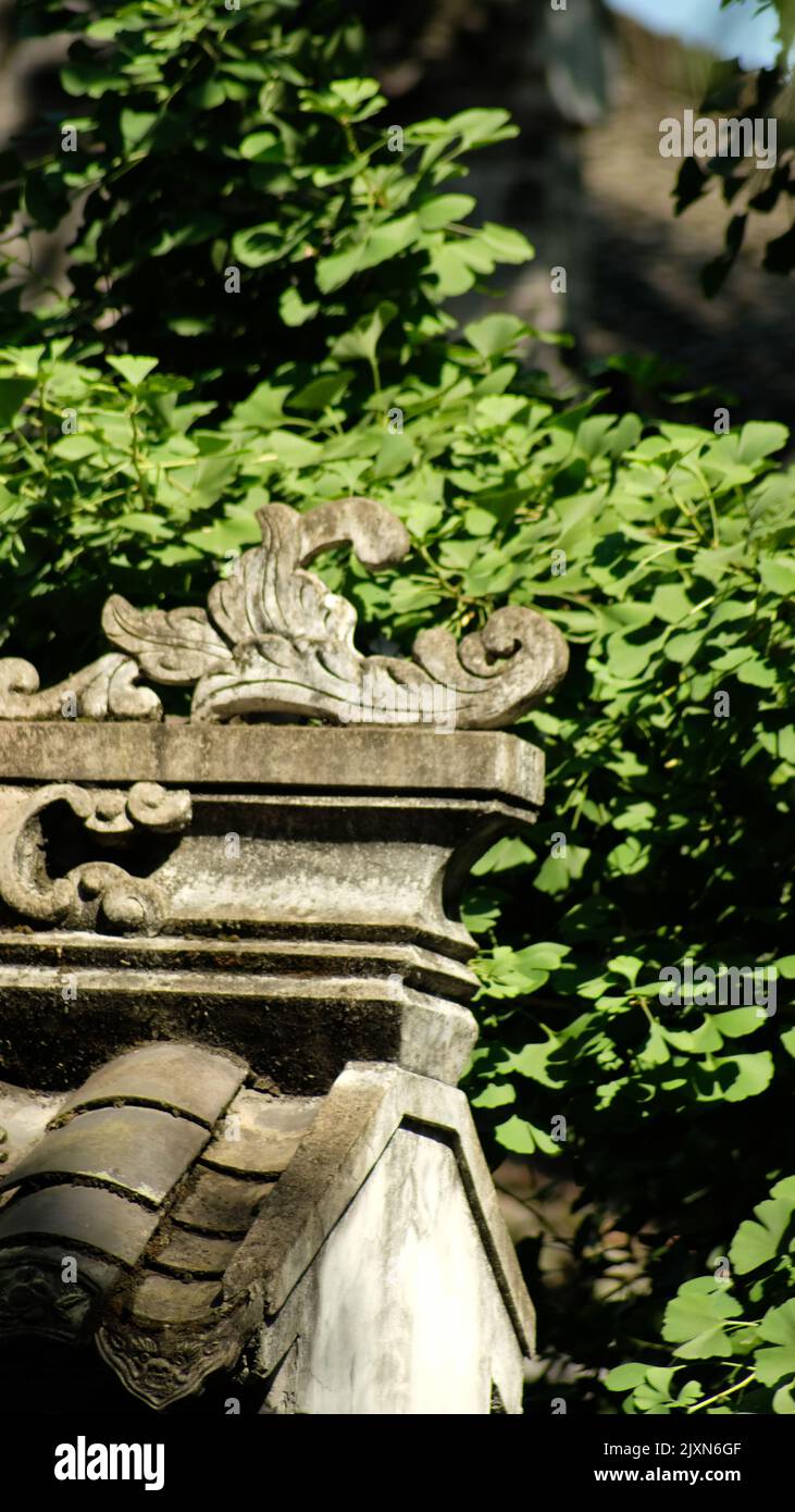 A vertical shot of a traditional Chinese house roof in Huanglongxi ...