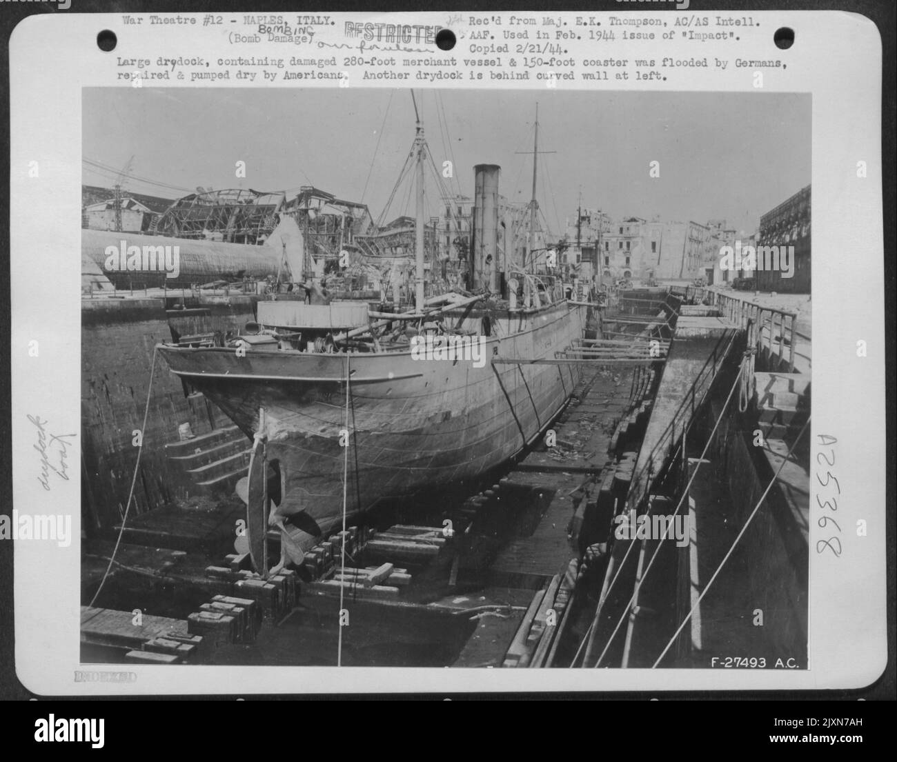 Large drydock, containing damaged 280-foot merchant vessel & 150-foot ...