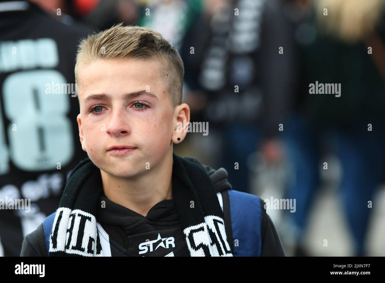 A Collingwood fan is seen following the 2018 AFL Grand Final between ...
